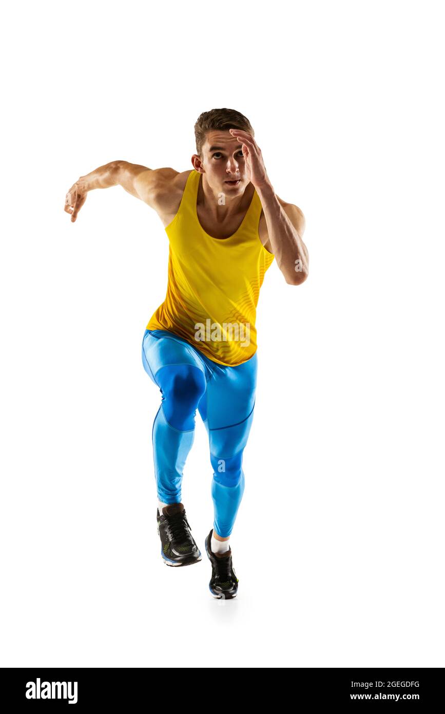 Portrait of professional male athlete, runner training isolated on ...