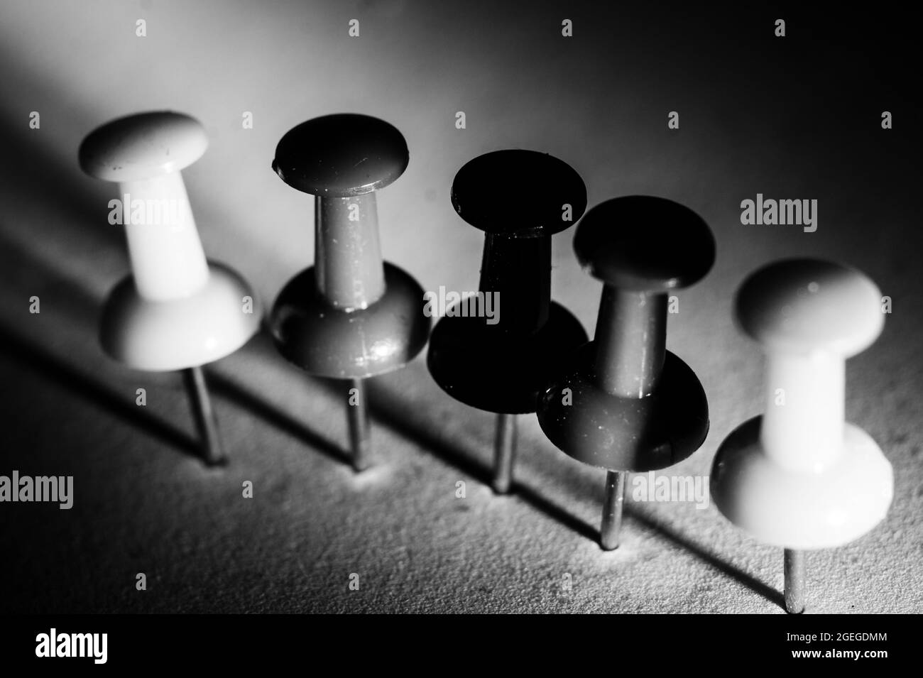 Grayscale of the pins with the black background Stock Photo - Alamy