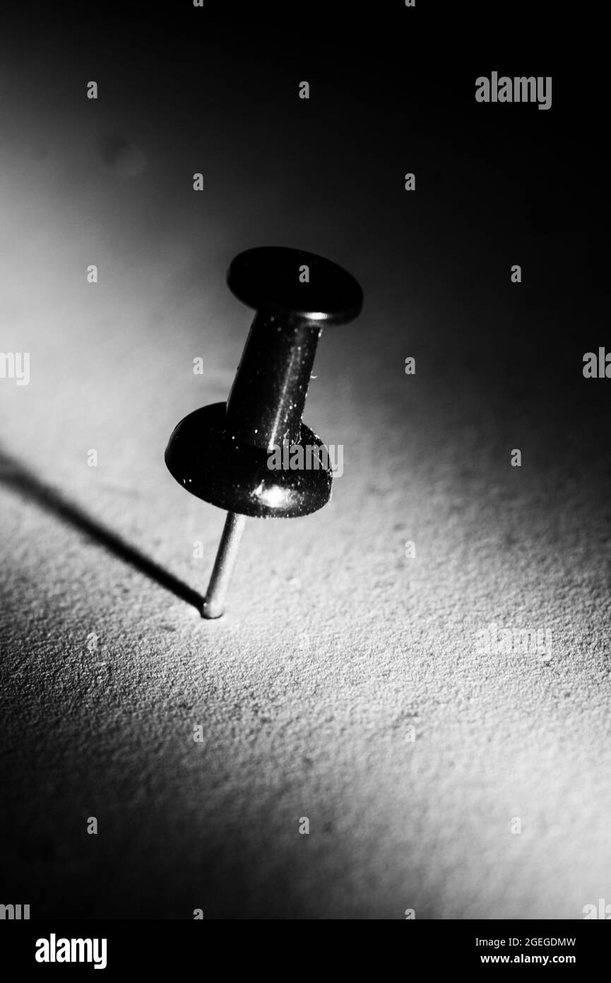 Grayscale of a pin with the black background Stock Photo - Alamy