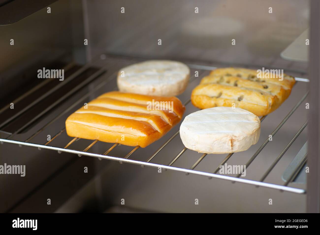 Cheese smoking on garden, camembert and gouda Stock Photo - Alamy