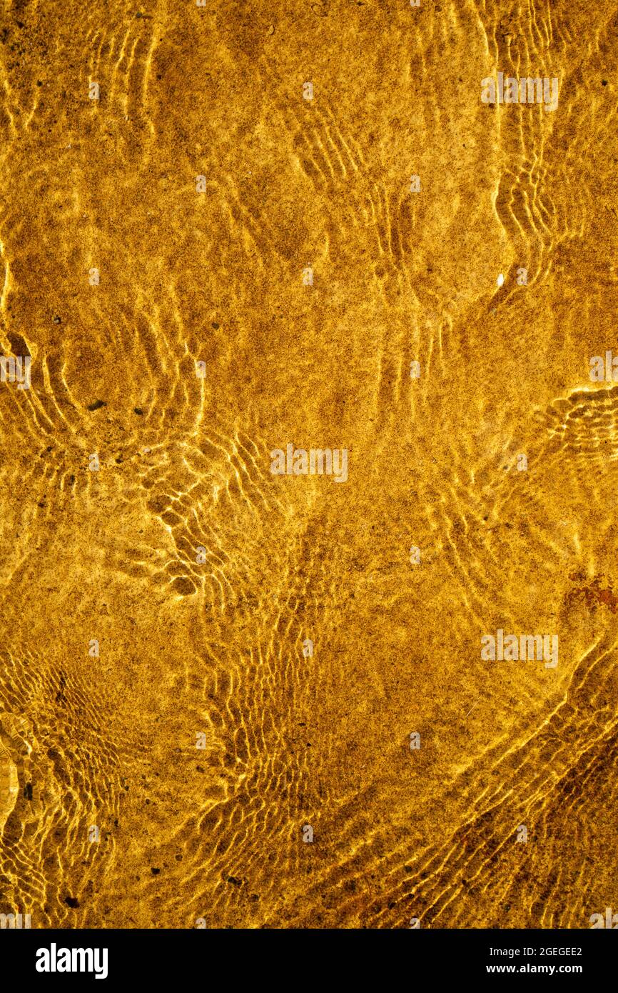 Background created by the movement of yellow waters in a small tank ...