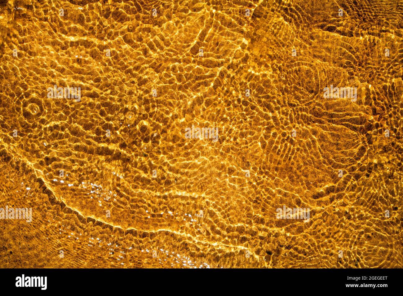 Background created by the movement of yellow waters in a small tank ...