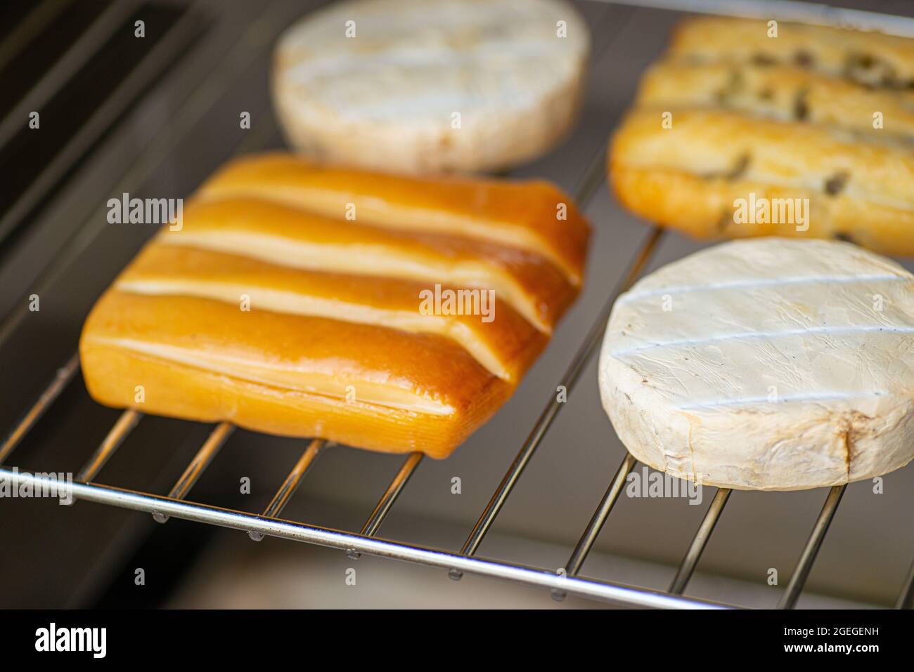 Cheese smoking on garden, camembert and gouda Stock Photo - Alamy