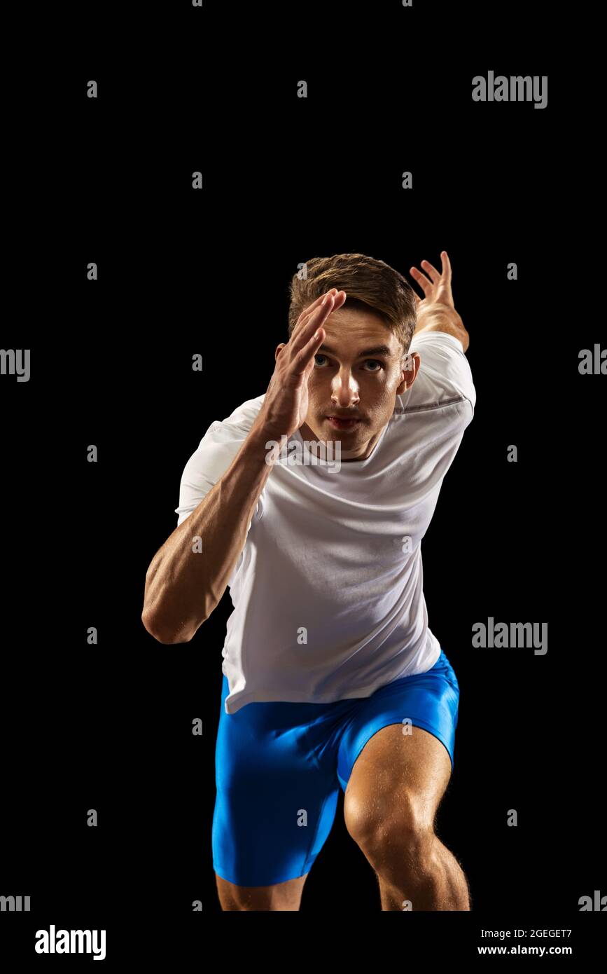 One muscular, sportive man, male athlete, runner training isolated on ...