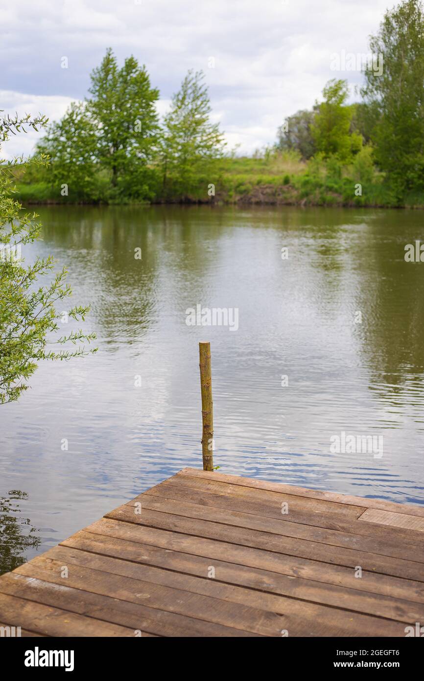 Wooden pier near the lake, outdoor recreation, sun, summer Stock Photo ...