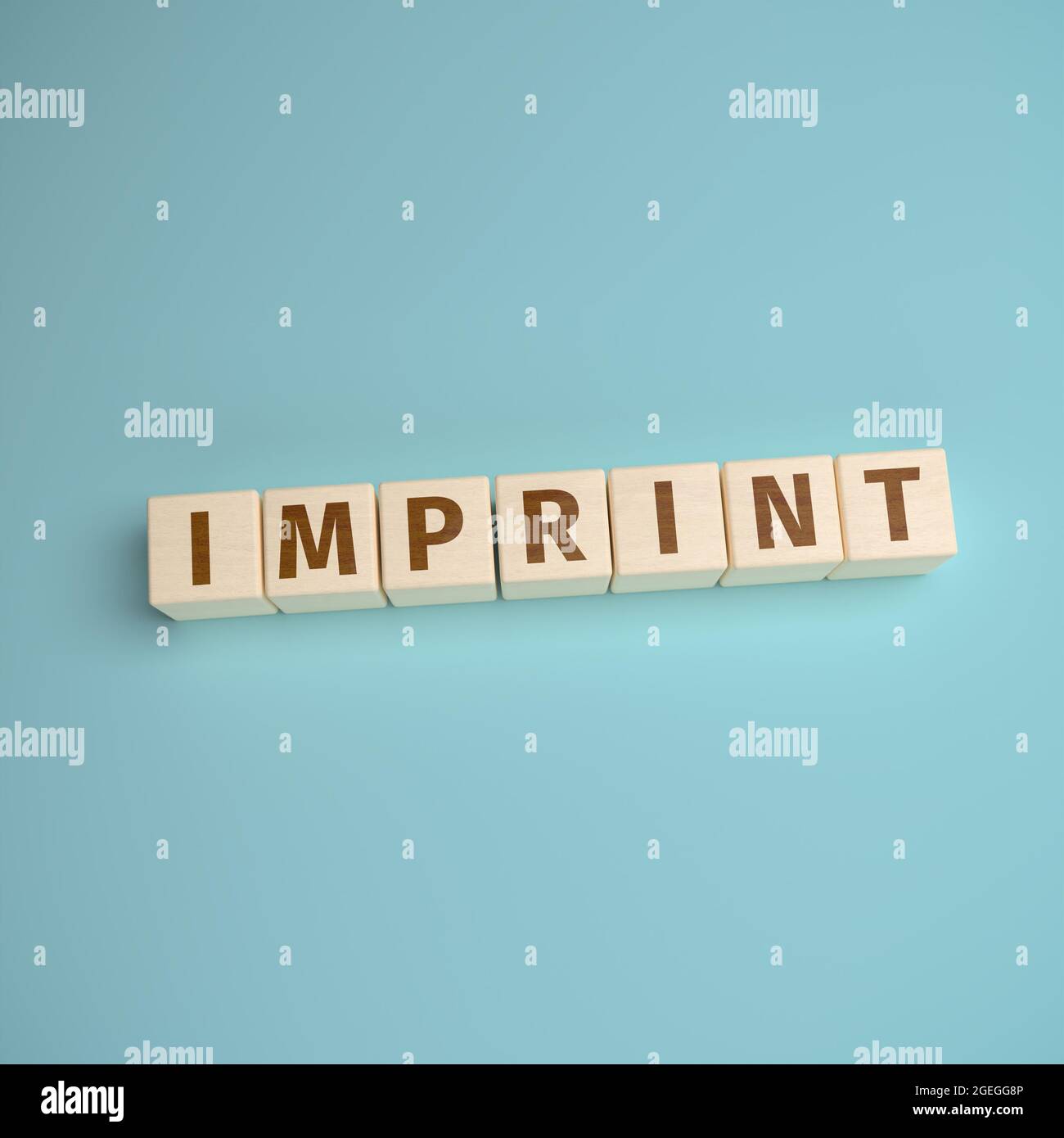 The word imprint built from letters on wooden cubes. High angle view ...