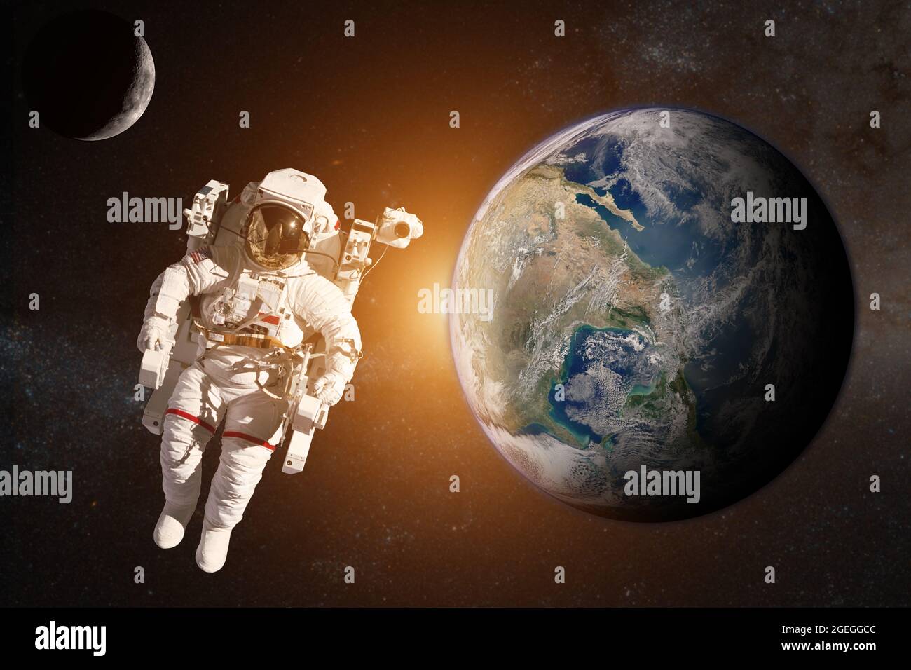 Astronaut in outer space on background of the Earth. Elements of this ...