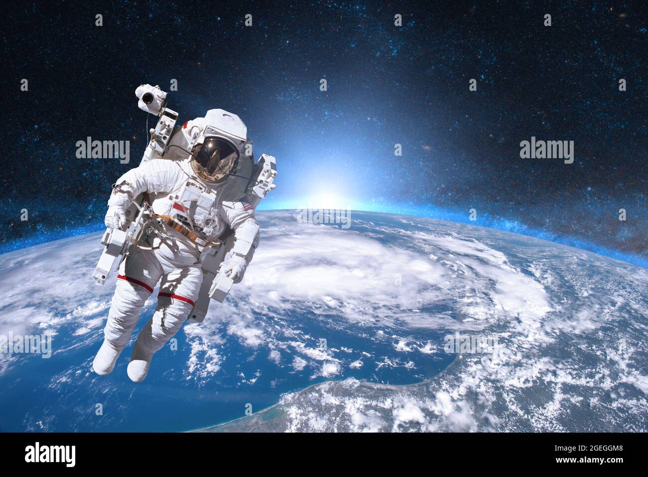 Astronaut in outer space on background of the Earth. Elements of this ...