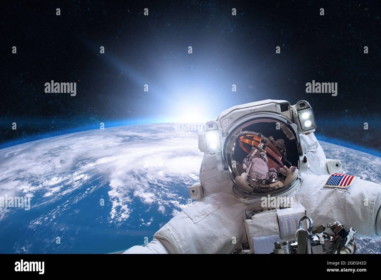 Astronaut in outer space on background of the Earth. Elements of this ...