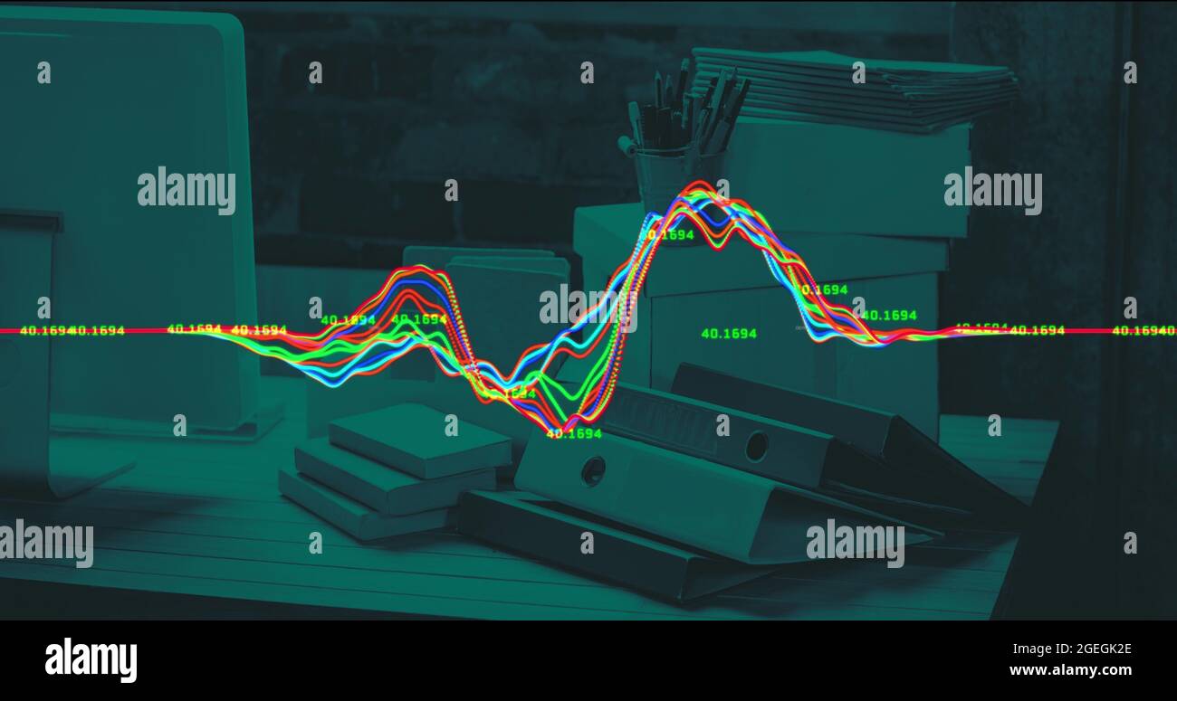 Image of financial data processing with fluctuating lines over office desk Stock Photo - Alamy