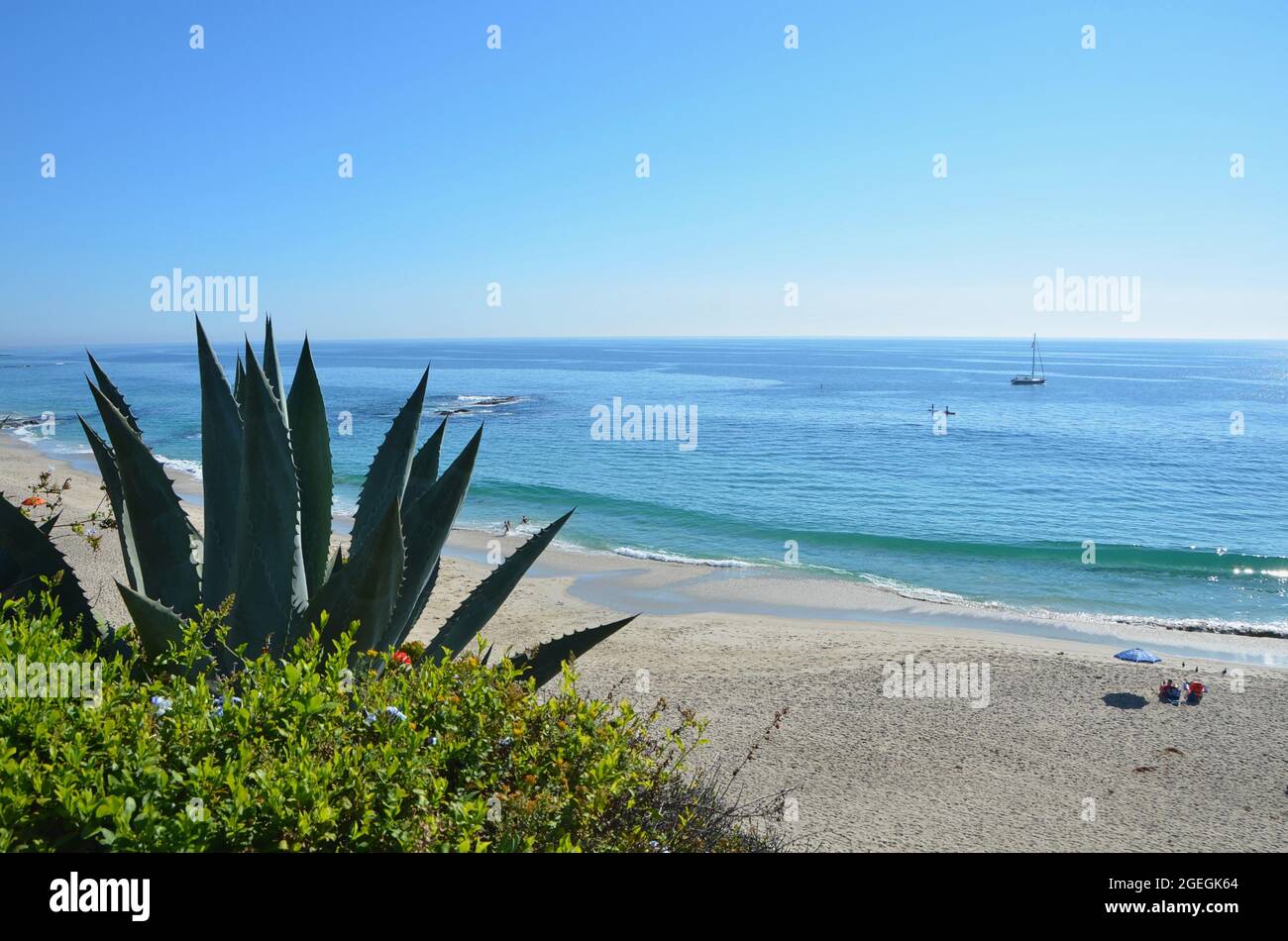 Scenic landscape with a sailing boat overlooking the Pacific Ocean in ...