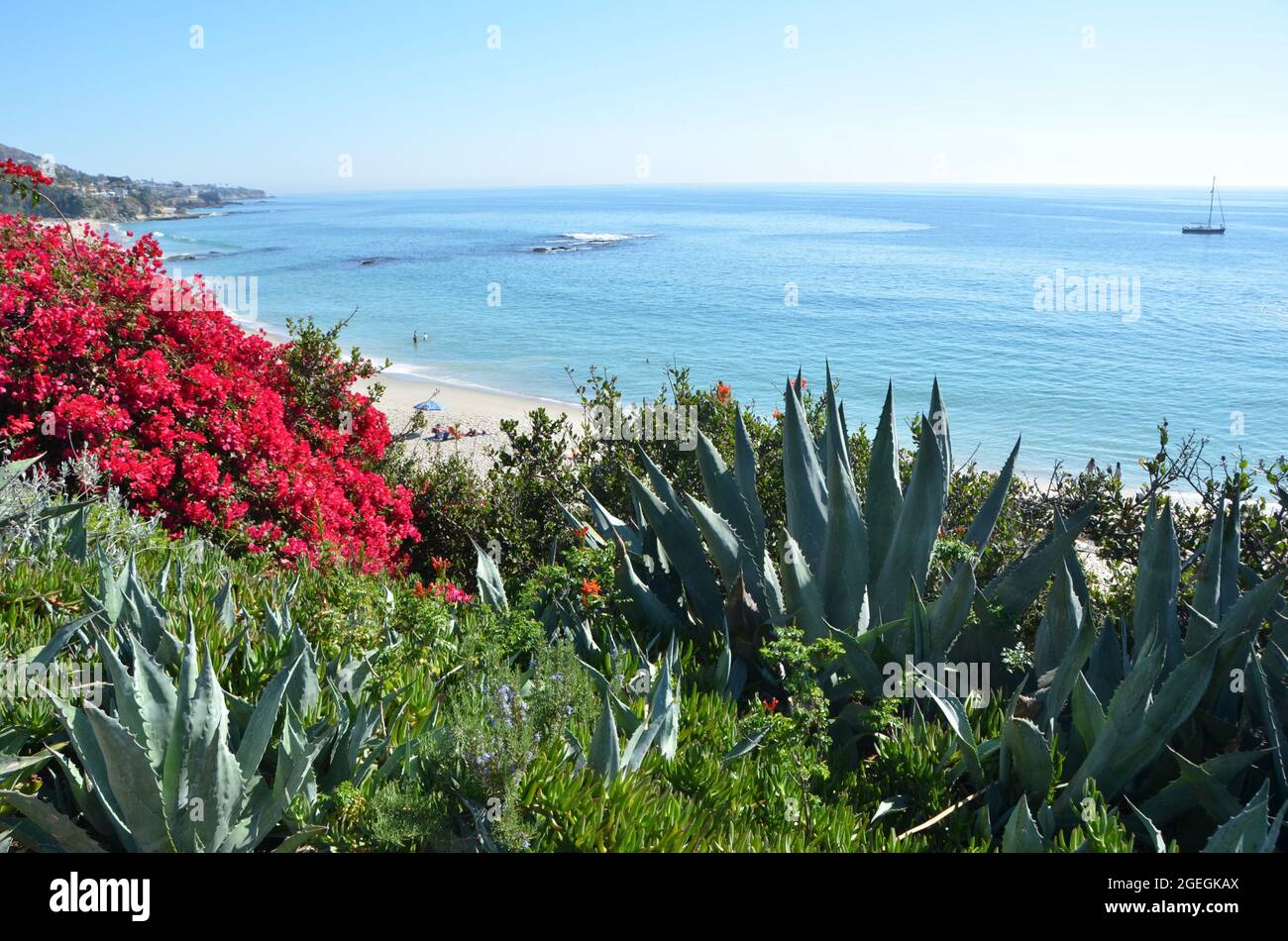 Scenic landscape with a sailing boat overlooking the Pacific Ocean in ...