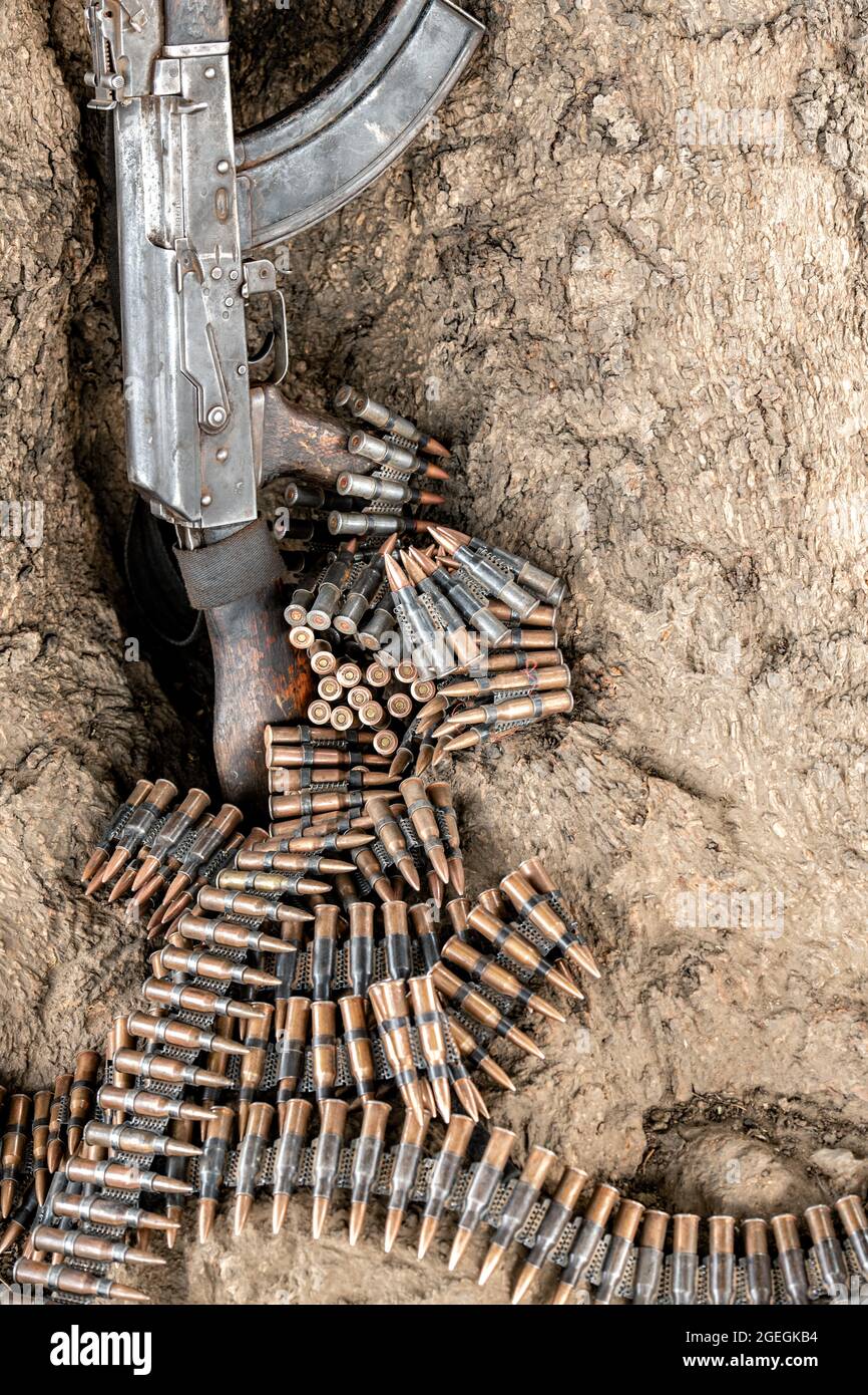The rounds of machine-gun bullets are often worn draped over the ...