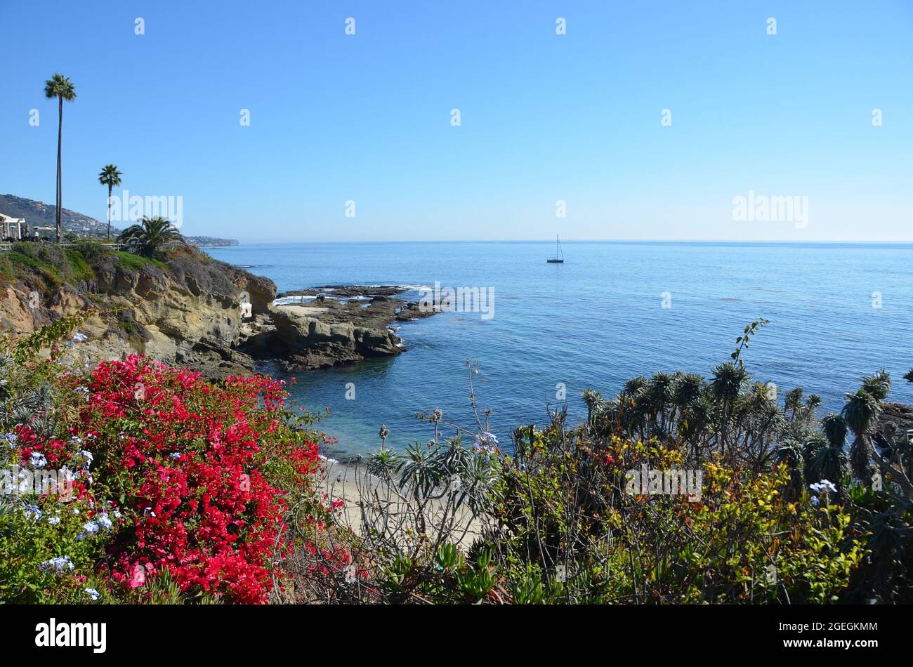 Scenic landscape with a sailing boat overlooking the Pacific Ocean in ...