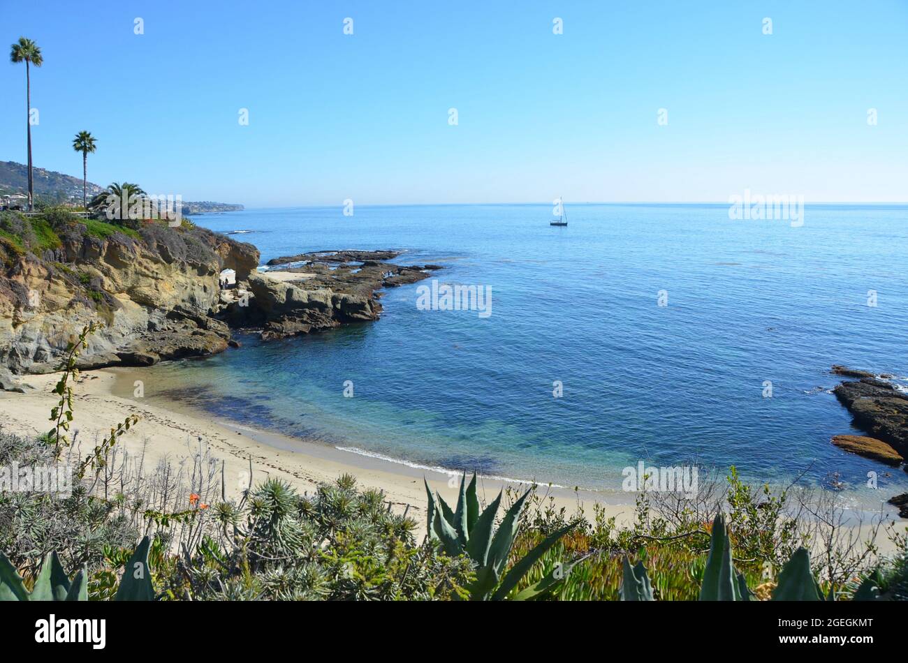 Scenic landscape with a sailing boat overlooking the Pacific Ocean in ...