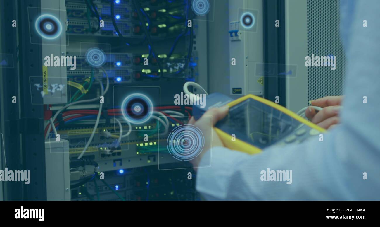 Multiple round scanners against mid section of man working in computer ... Multiple round scanners against mid section of man working in computer ...