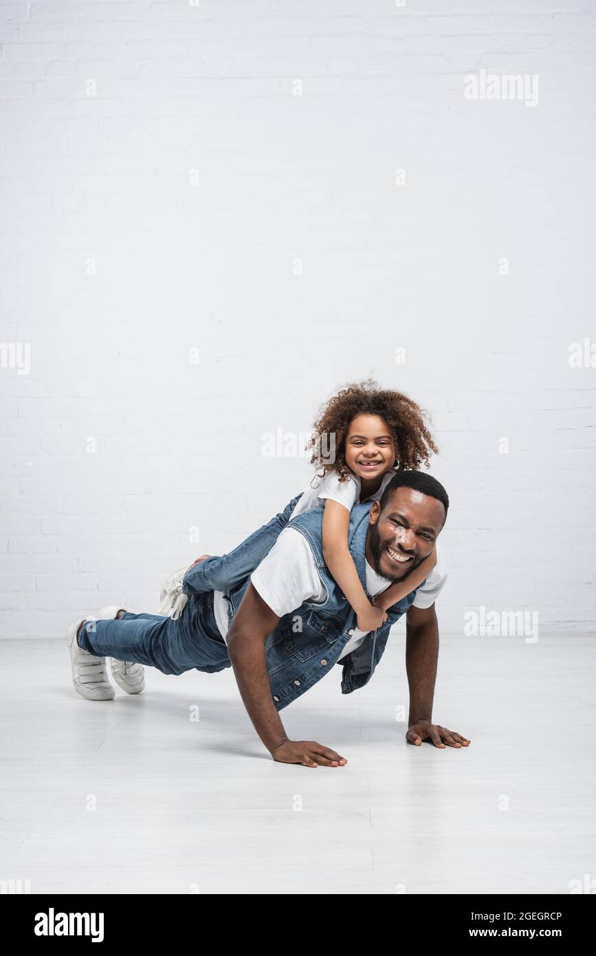 Piggyback pose hi-res stock photography and images - Alamy