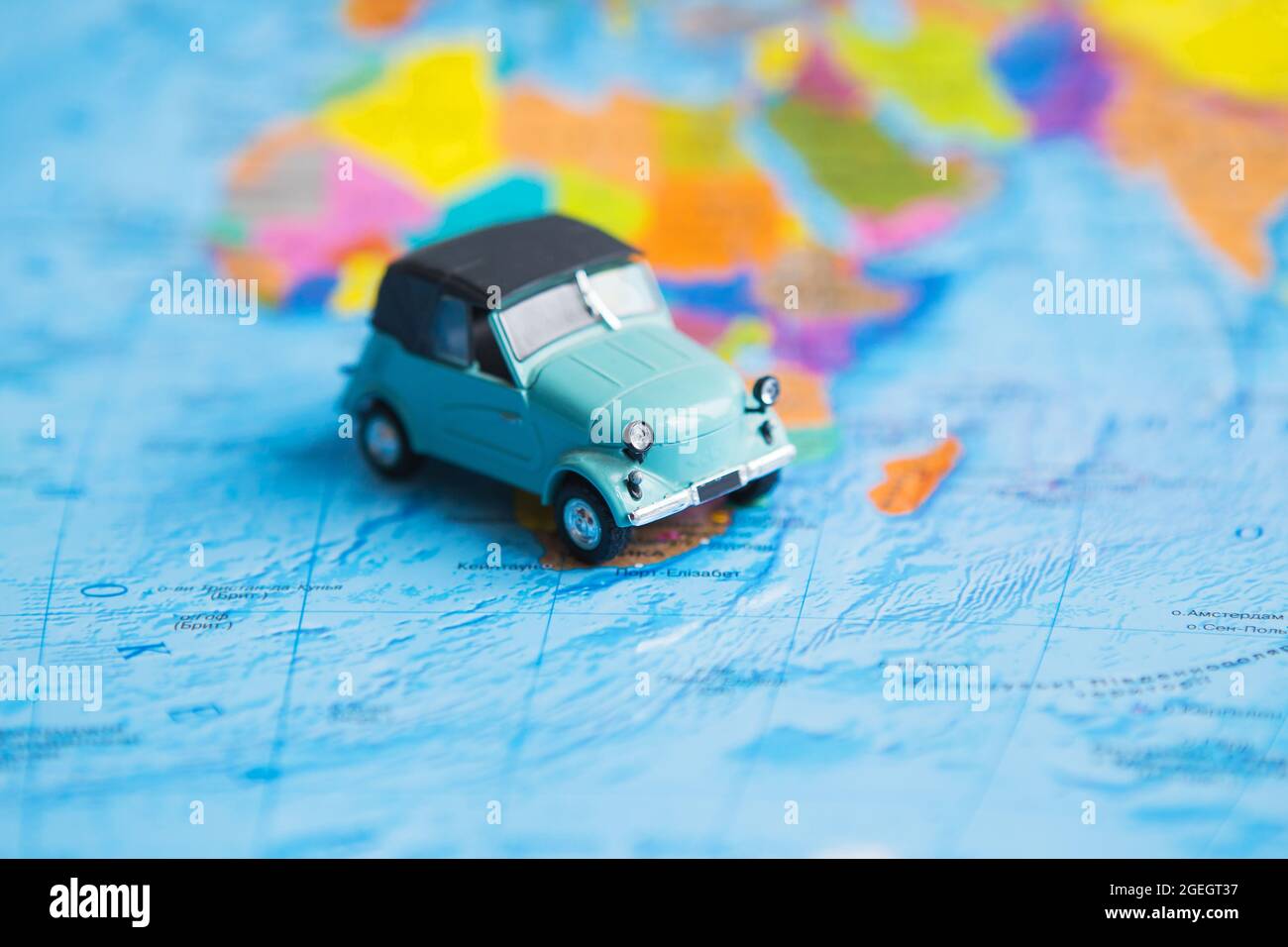 retro car on colorful world map, travel Stock Photo - Alamy