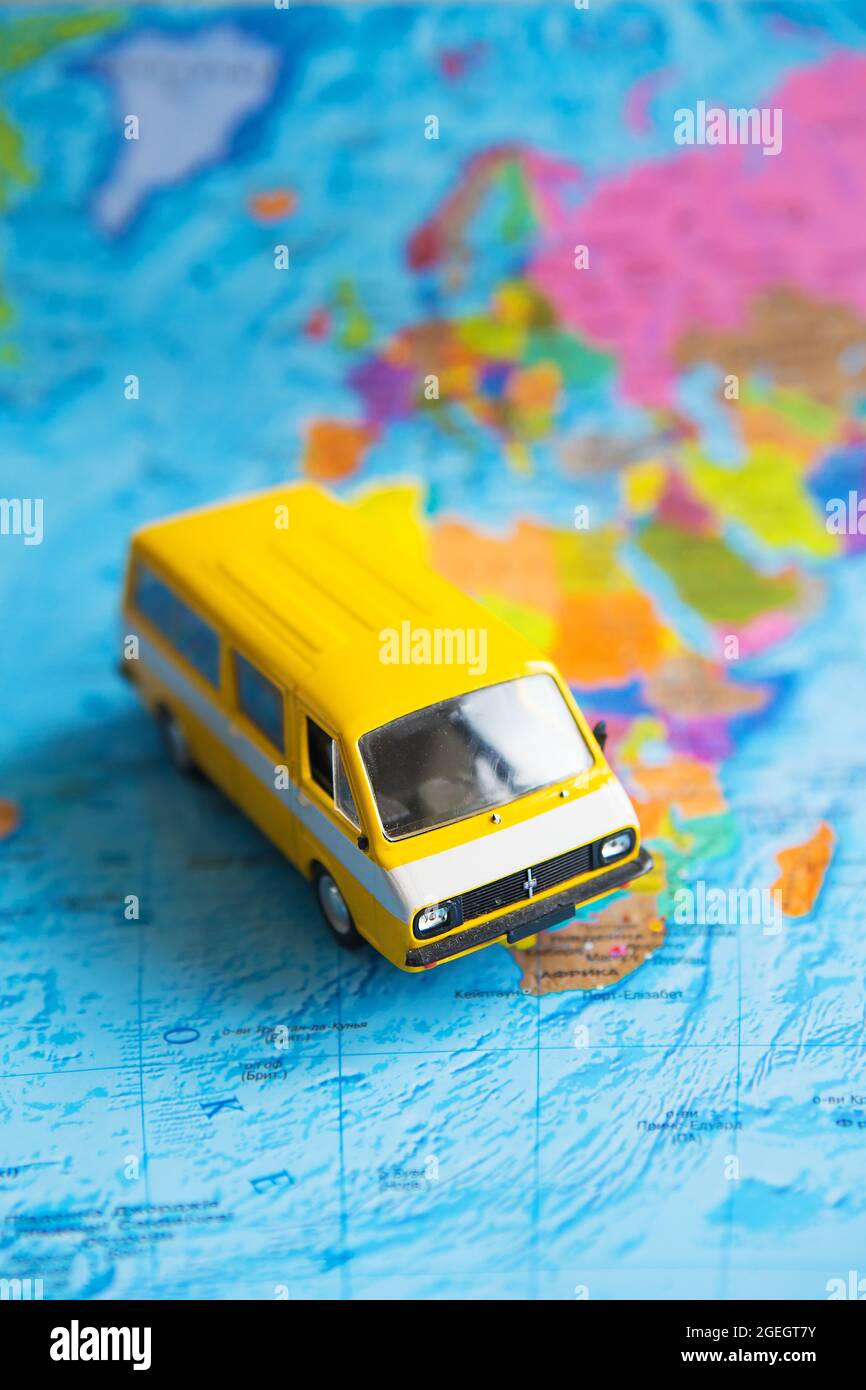 Travel around the world by bus. World map, close-up Stock Photo - Alamy