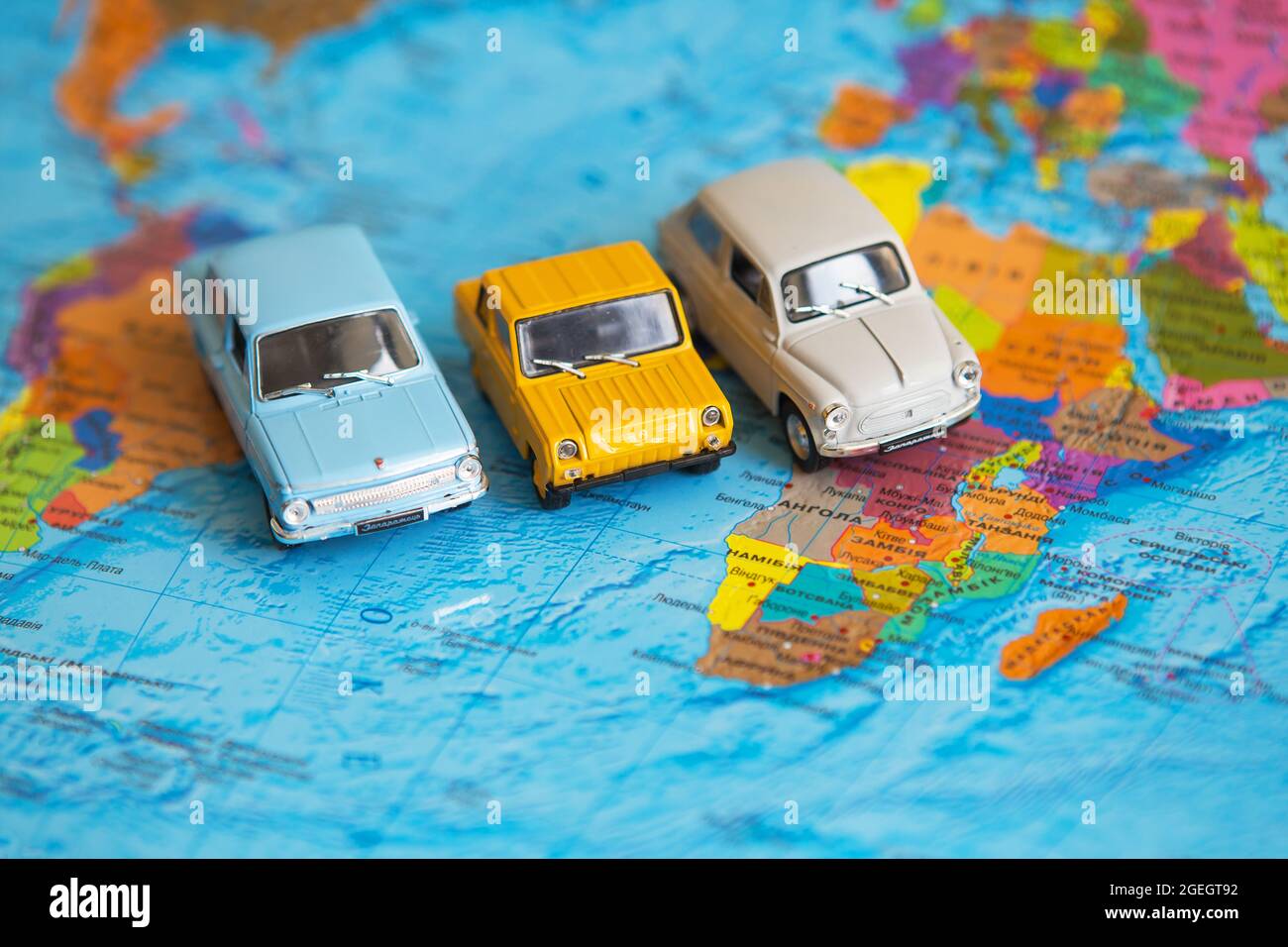three retro car on colorful world map, travel, road Stock Photo - Alamy