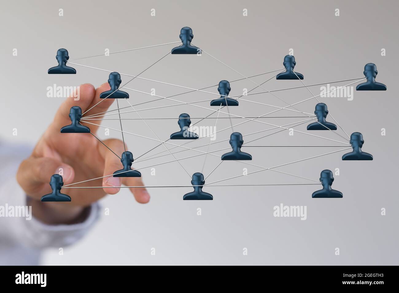 Male's hand pointing to illustrated organization chart team concept ...