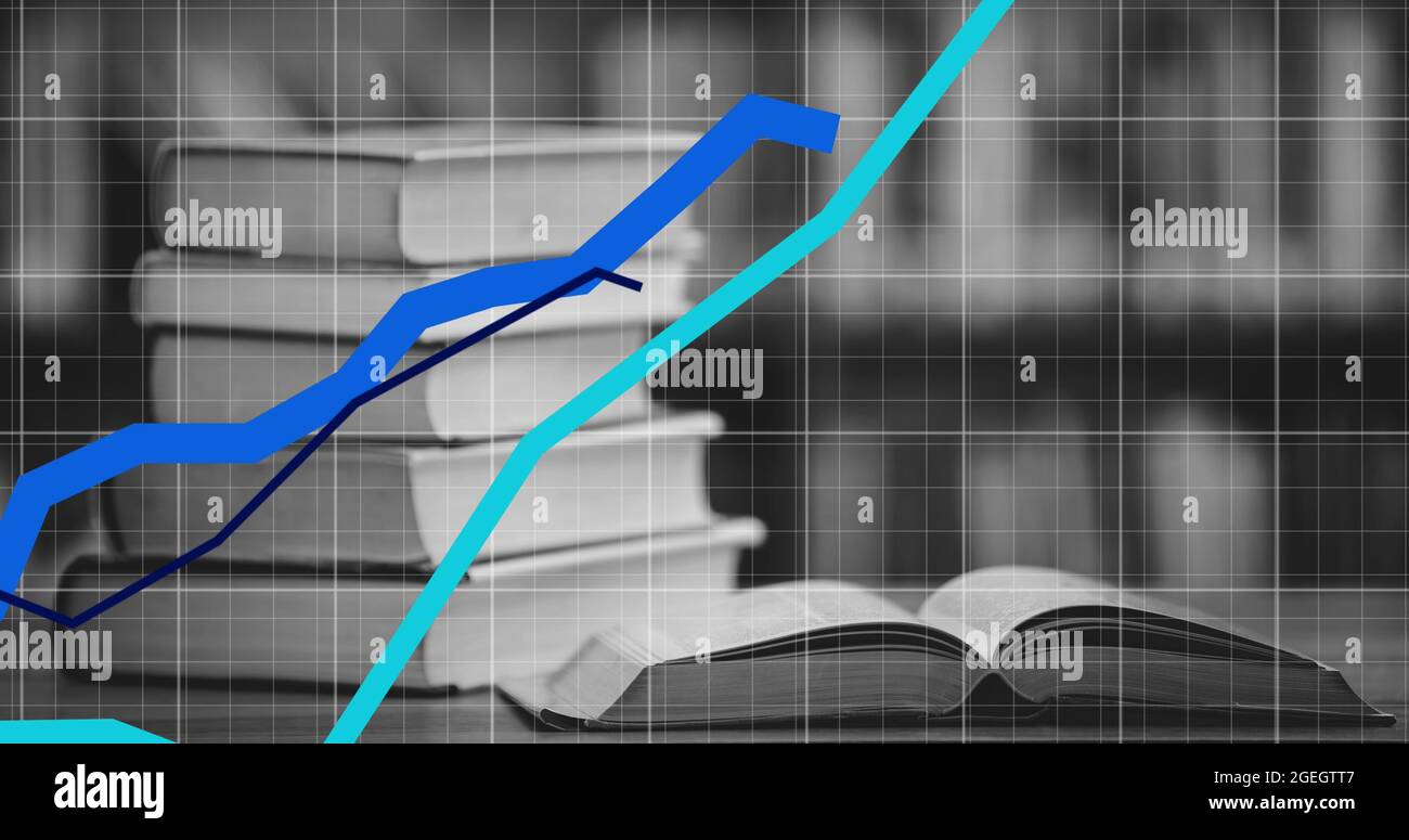 Multiple blue graphs moving over grid network against stack of books ...