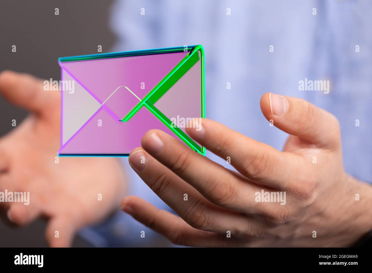 Male's hands holding illustrated email inbox sign Stock Photo - Alamy