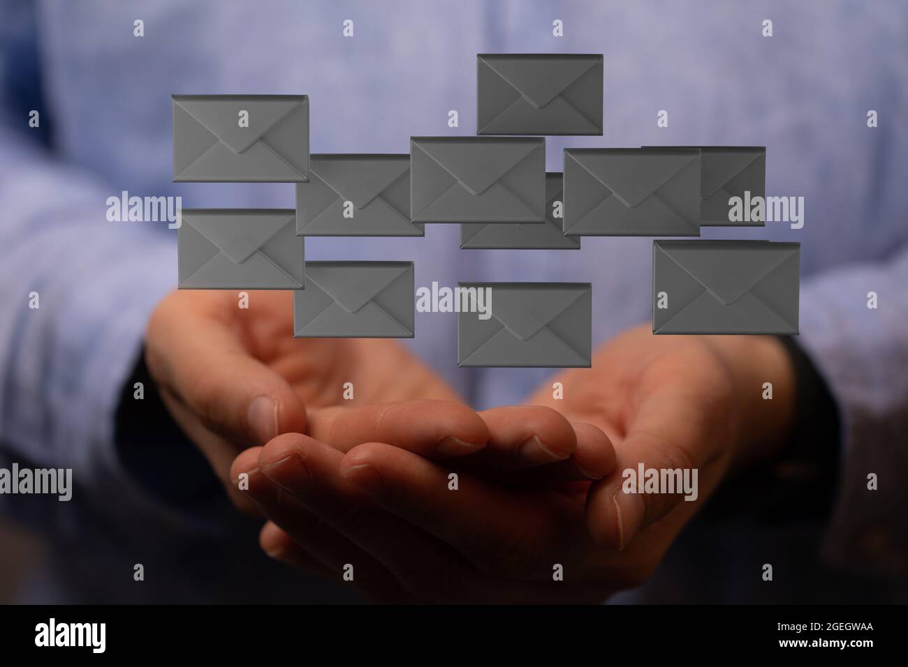 Male's hands holding illustrated email inbox signs Stock Photo - Alamy