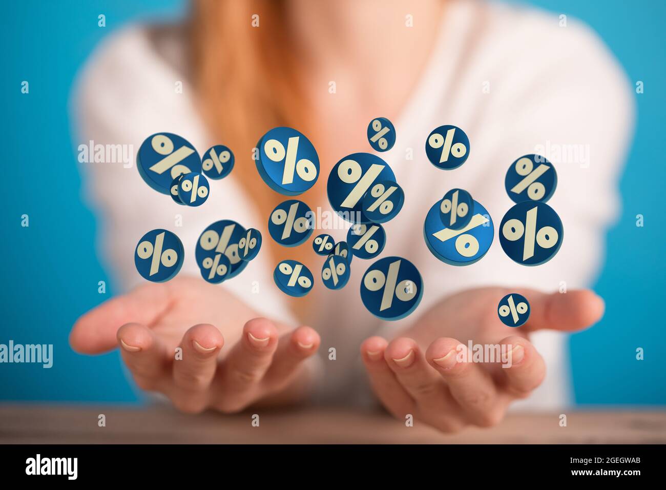 Female's hands holding illustrated blue percent signs/symbols Stock ...