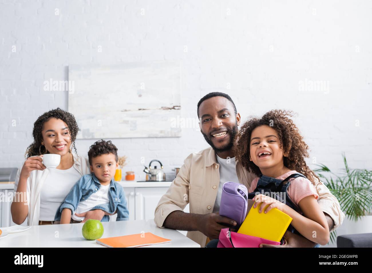 Mother boy packing backpack hi-res stock photography and images - Alamy