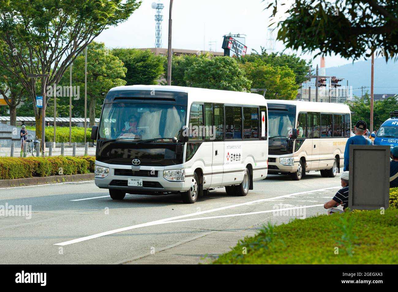 Tokyo 2020 Olympic Torch Relay. Car parade with partners and sponsors ...