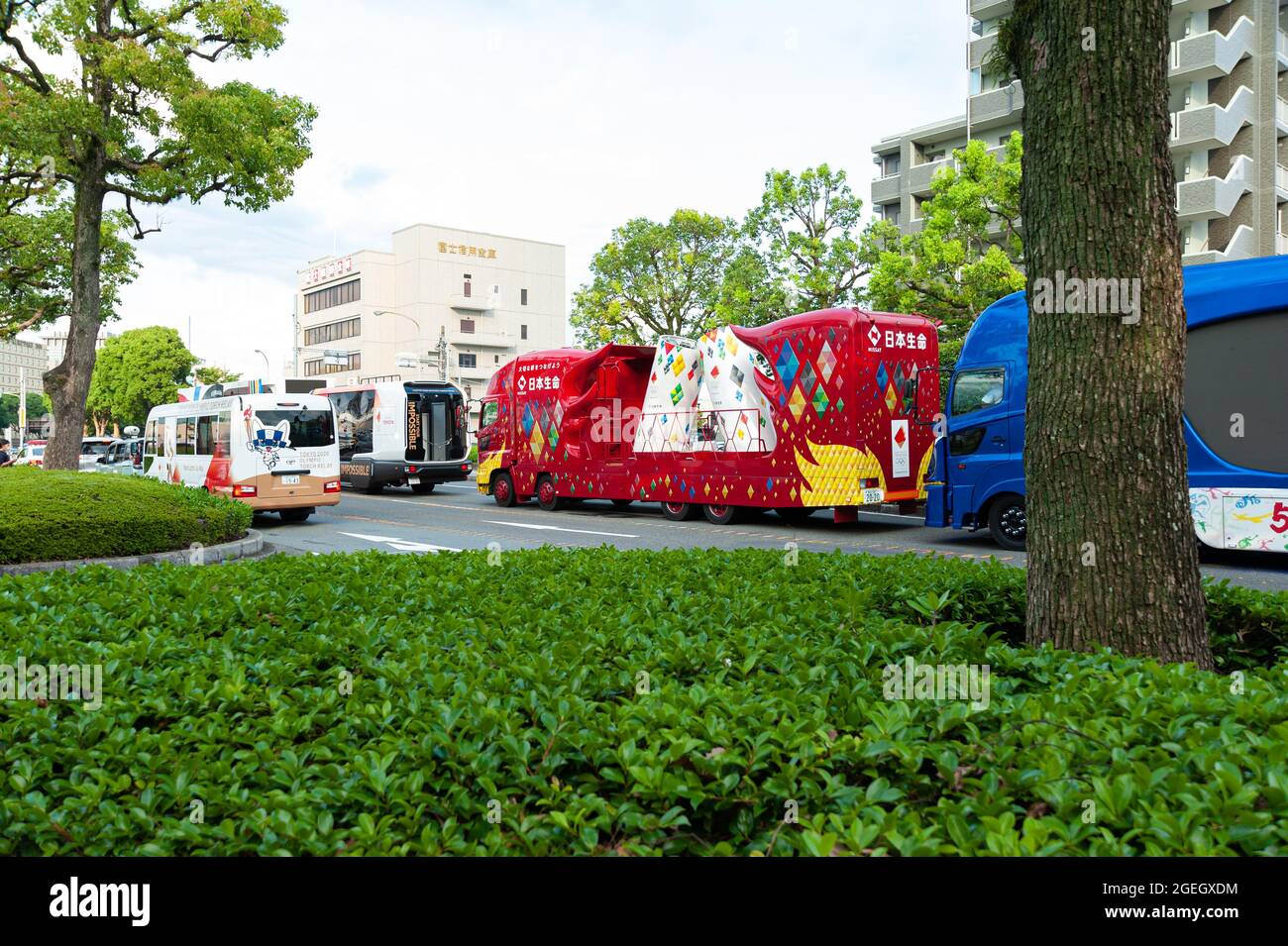 Tokyo 2020 Olympic Torch Relay. Car parade with partners and sponsors ...