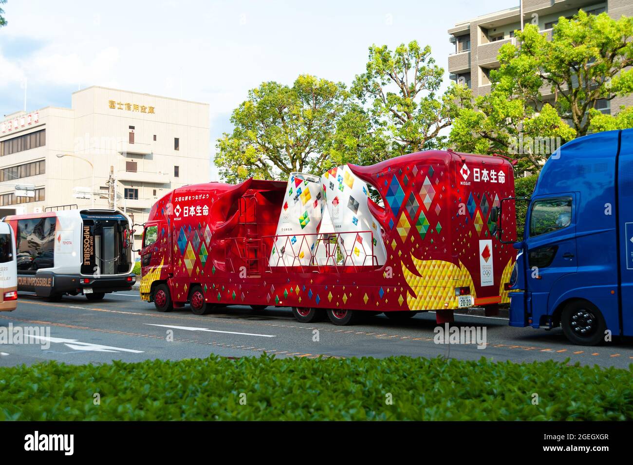 Tokyo 2020 Olympic Torch Relay. Car parade with partners and sponsors ...