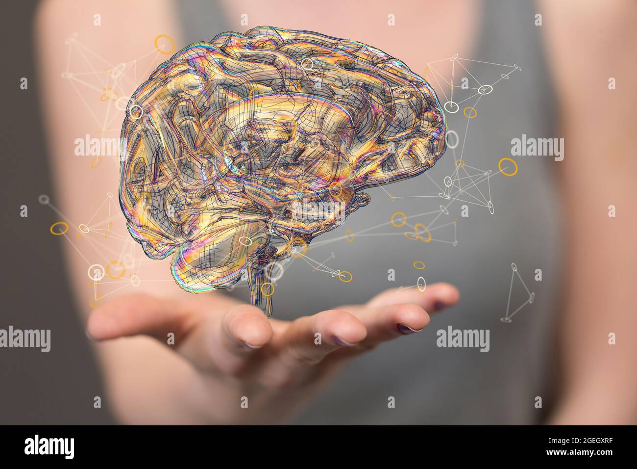 Female's hand holding an illustrated brain - brain testing result with ...