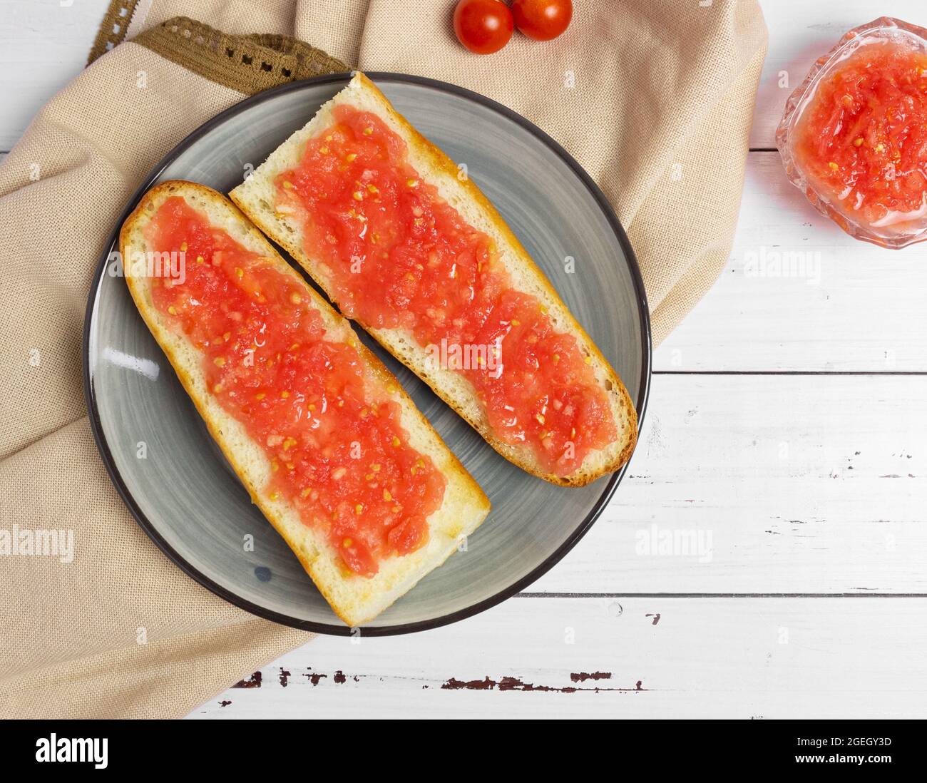 Toast with tomato, traditional Spanish breakfast. Olive oil, top view ...