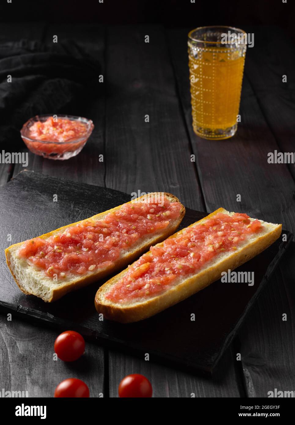 Toast with tomato, traditional Spanish breakfast. Olive oil, black ...