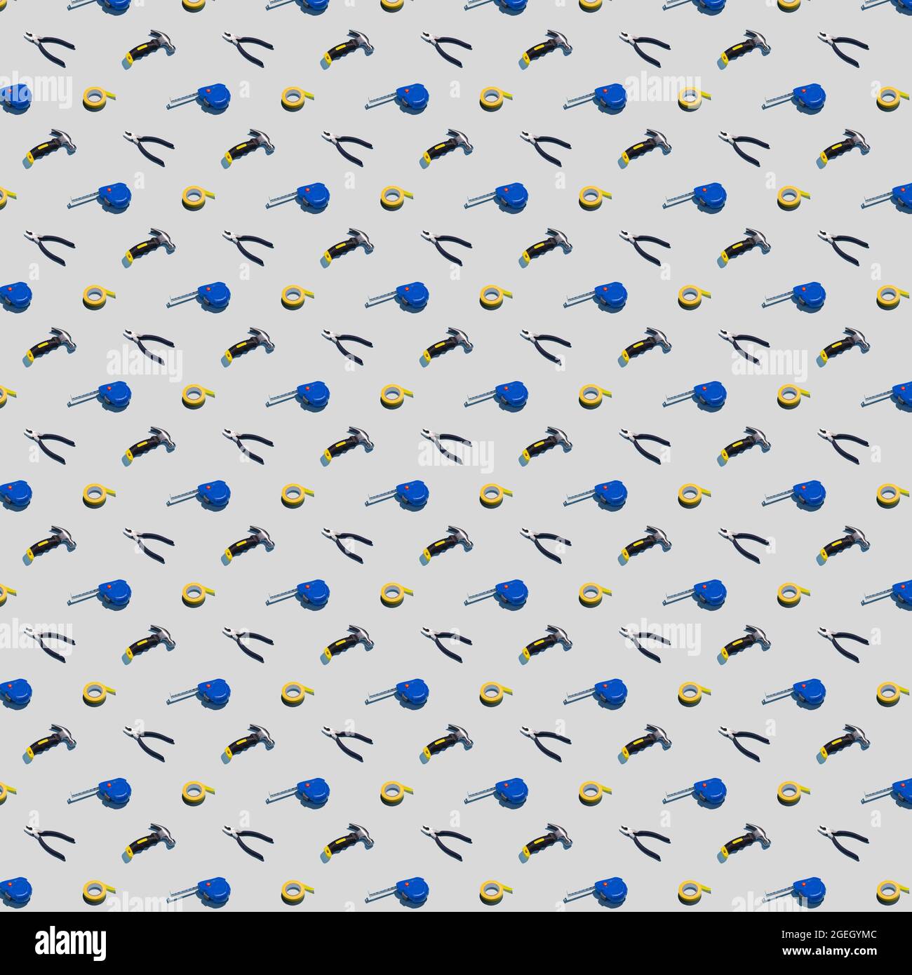 Hammer, tape measure, duct tape and pliers, pattern on a white ...