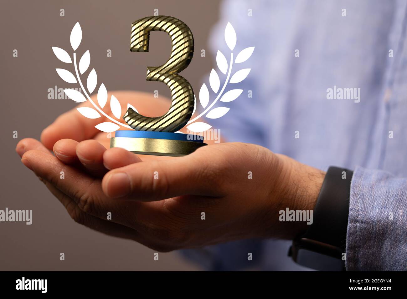 3rd place letter in 3d in hand Stock Photo - Alamy
