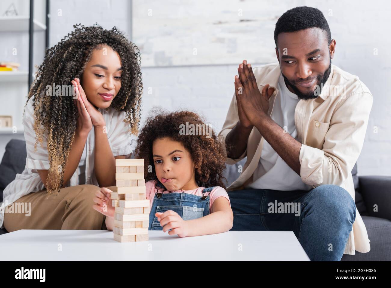 Girl kid playing game rubbing hi-res stock photography and images - Alamy