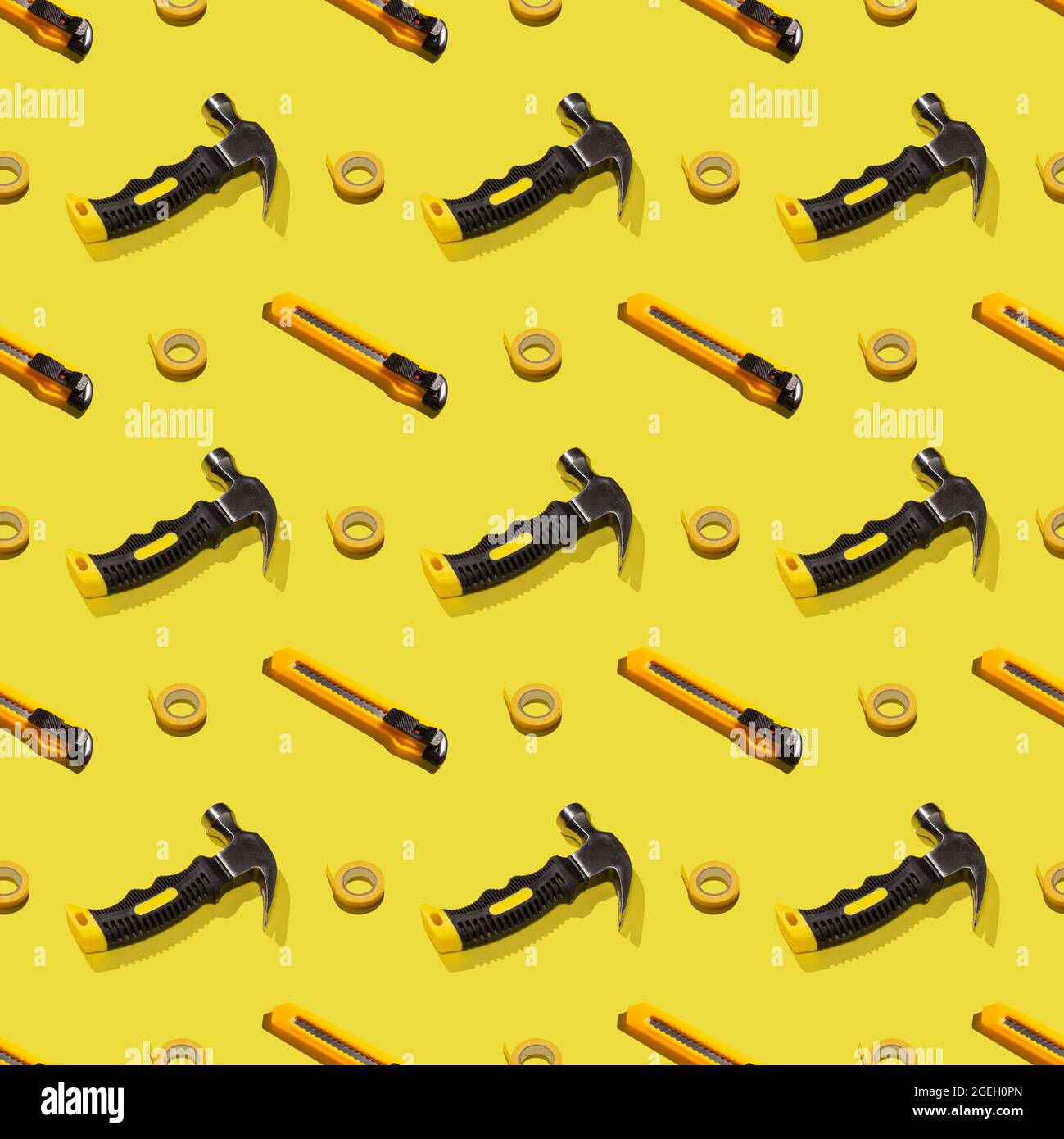 Hammers, knives, and duct tape on a yellow background, pattern, hard shadows. Construction tools ...