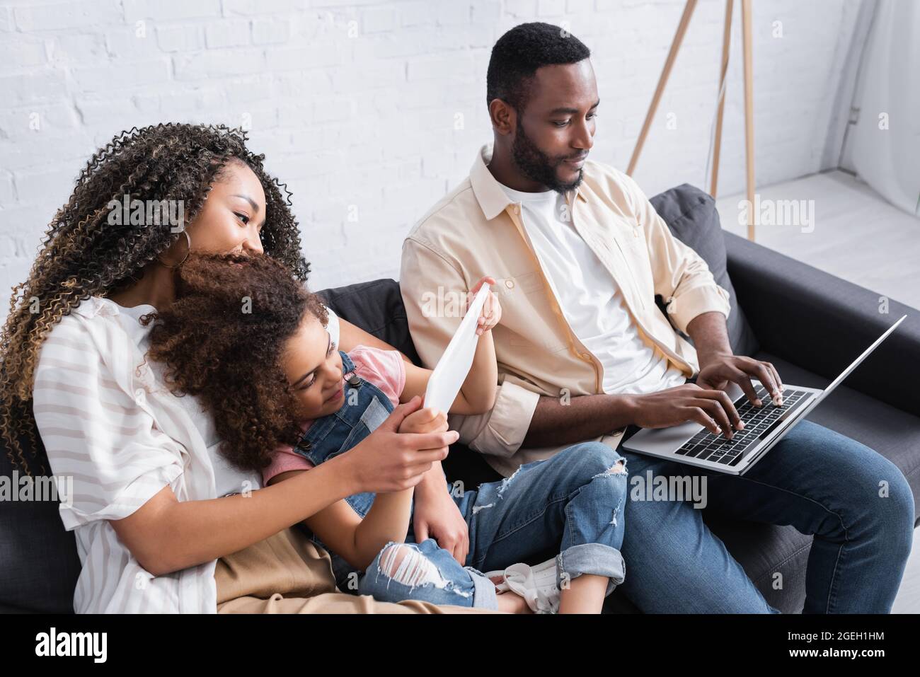 Afro american family couple using hi-res stock photography and images ...
