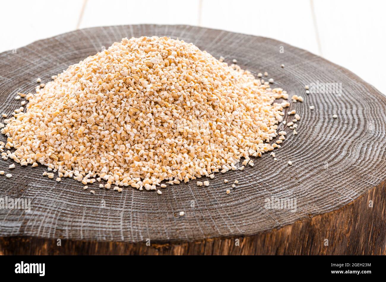 Raw dried broken barley cereal grain texture background macro closeup ...