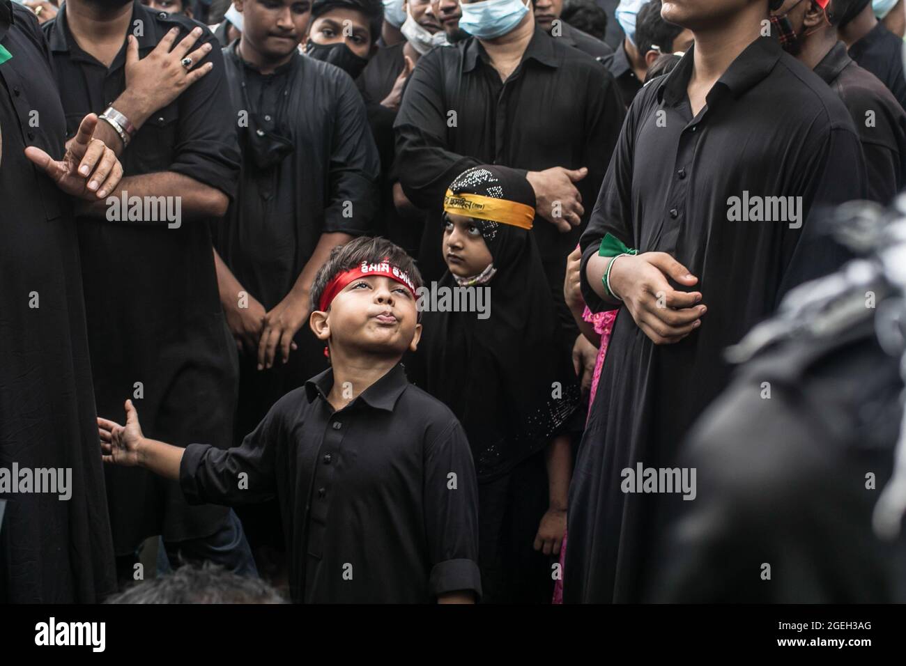 A Bangladesh Shia boy looks on during the month of Muharram to mark ...