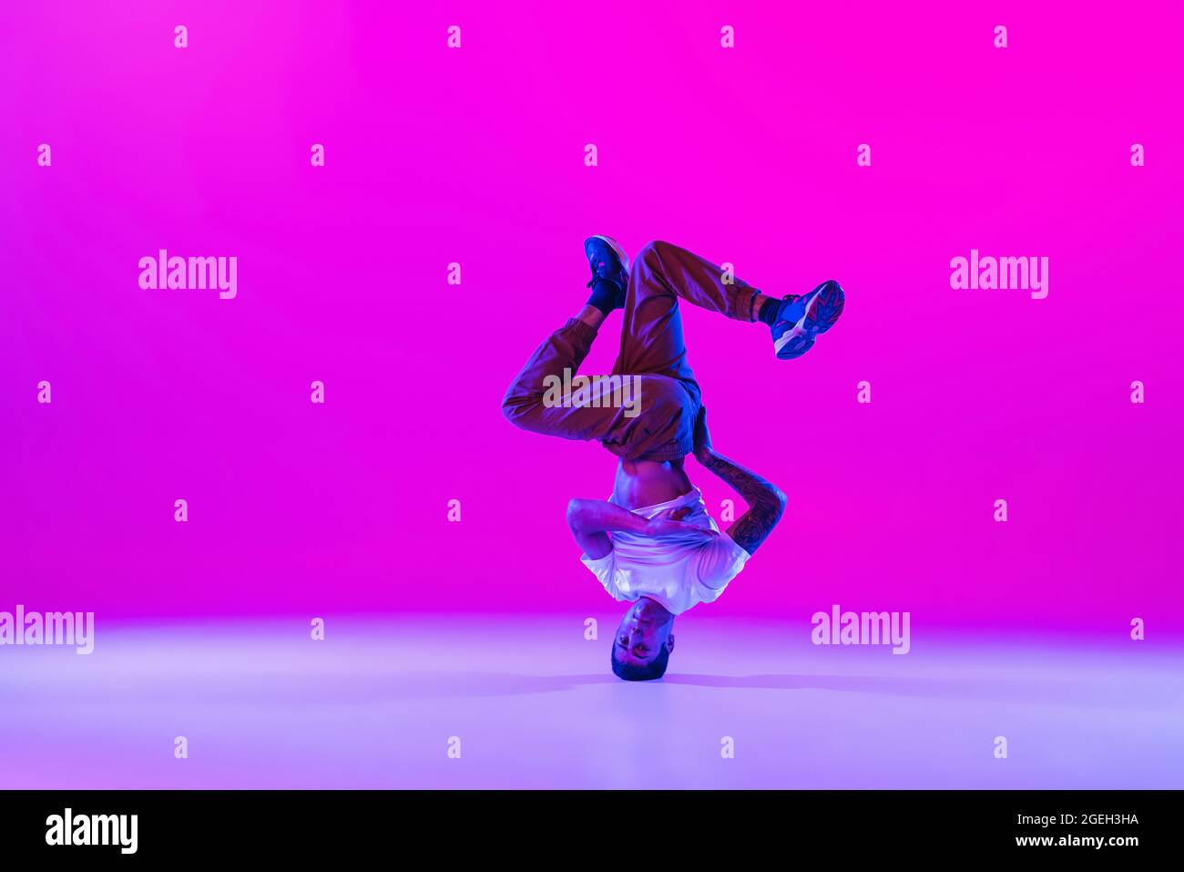 Portrait of young man, break-dance dancer dancing solo in modern ...