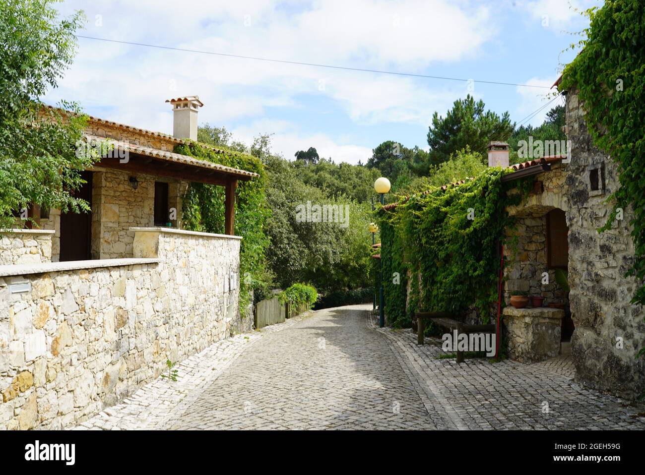 Beautiful cobblestone pathway surrounded by the traditional houses in ...