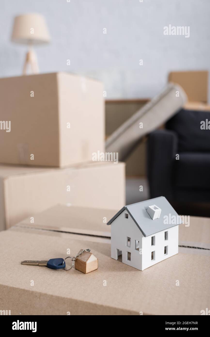 house model and key on carton box in new apartment Stock Photo - Alamy