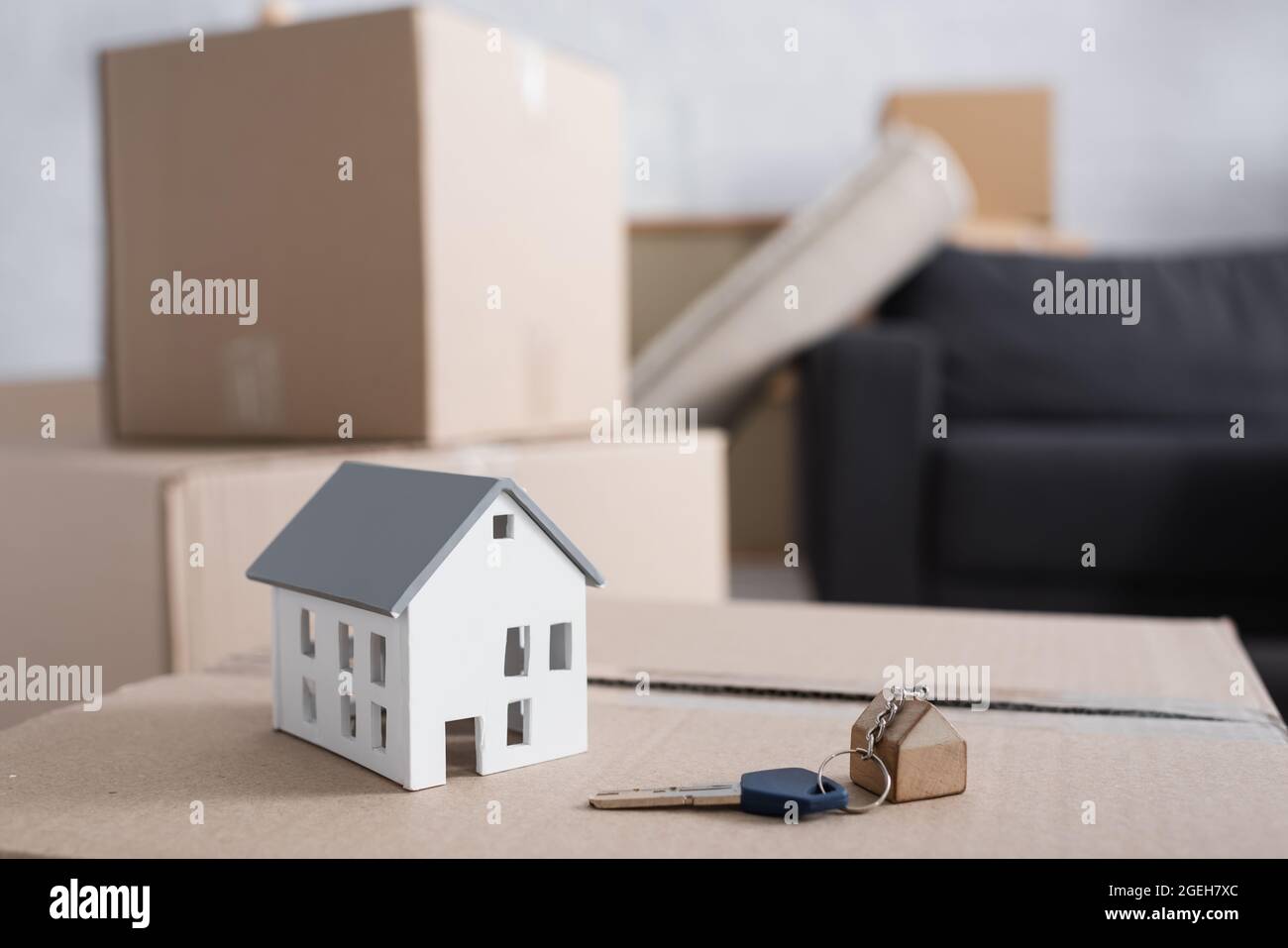 key and house model on carton box in new apartment Stock Photo - Alamy