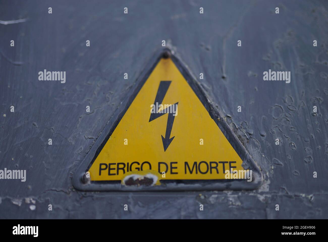 Closeup of a weathered metallic yellow triangle electricity sign Stock ...
