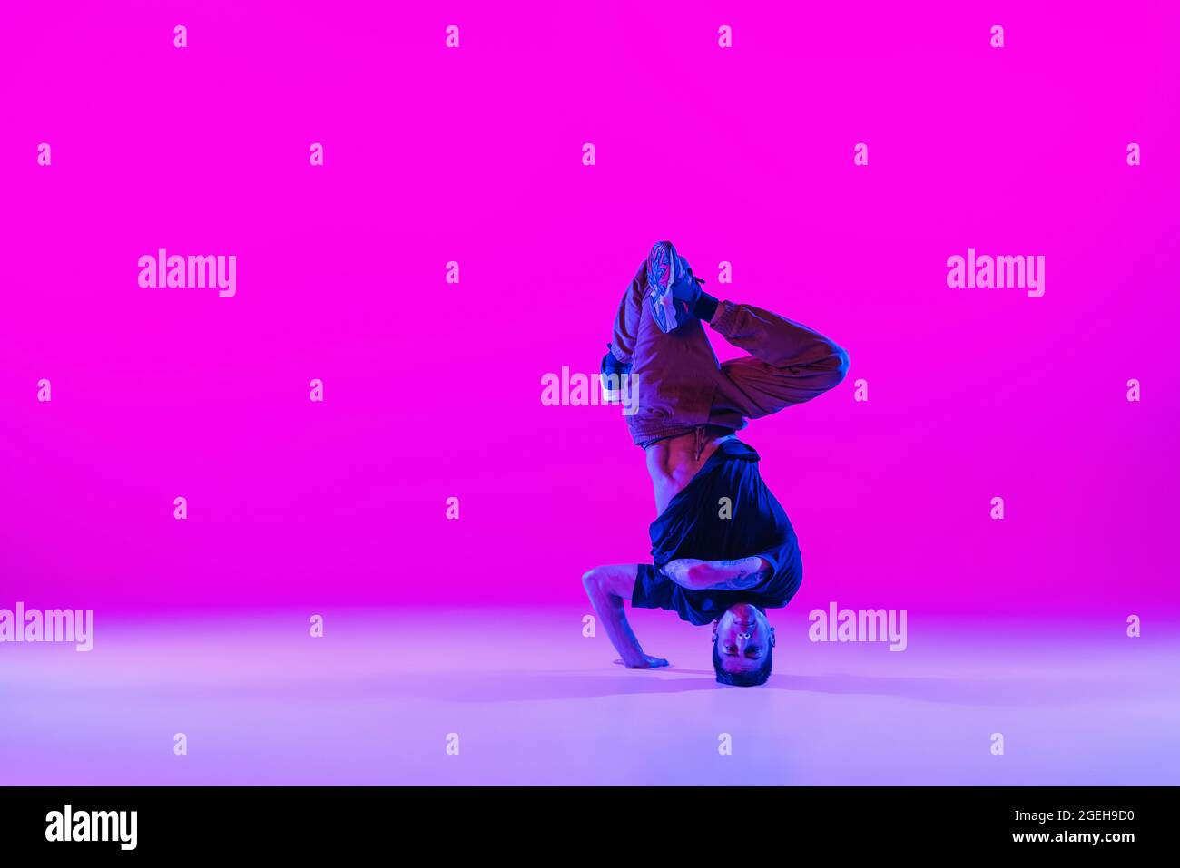 Portrait of young man, break-dance dancer dancing solo in modern ...