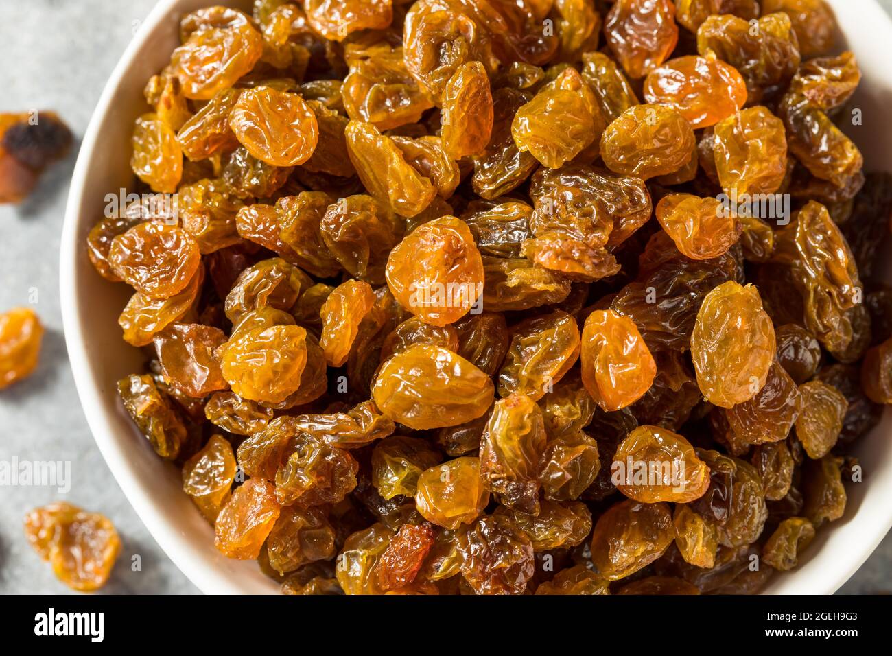Healthy Organic Golden Raisins in a Bowl Stock Photo - Alamy